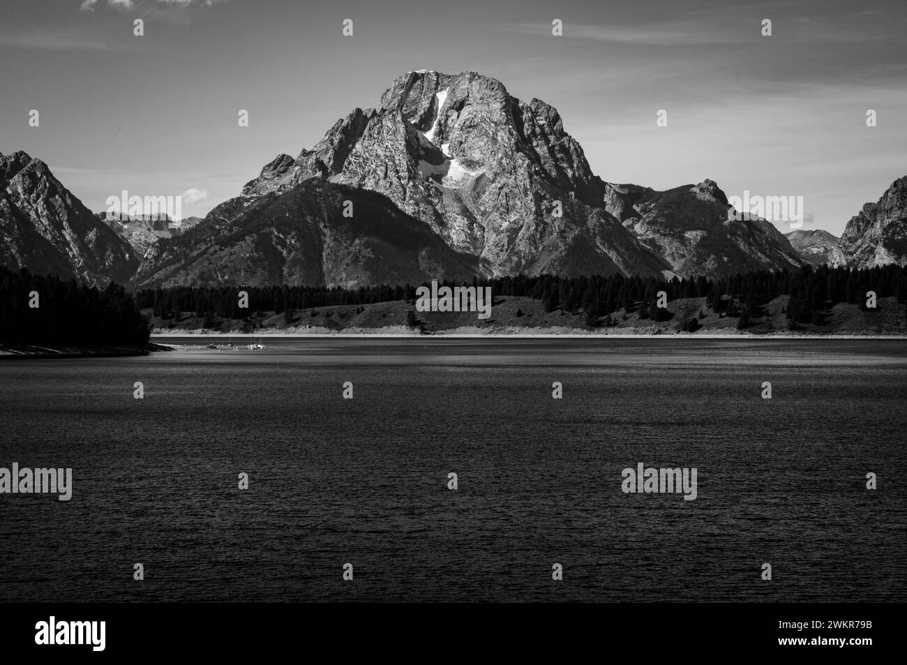 A grayscale of Jackson Lake with the Teton Mountain Range in Jackson ...