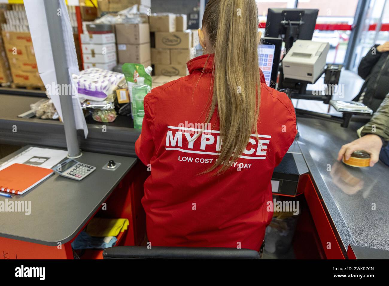 Opwijk, Belgium. 22nd Feb, 2024. A cashier seen at the register, inside ...