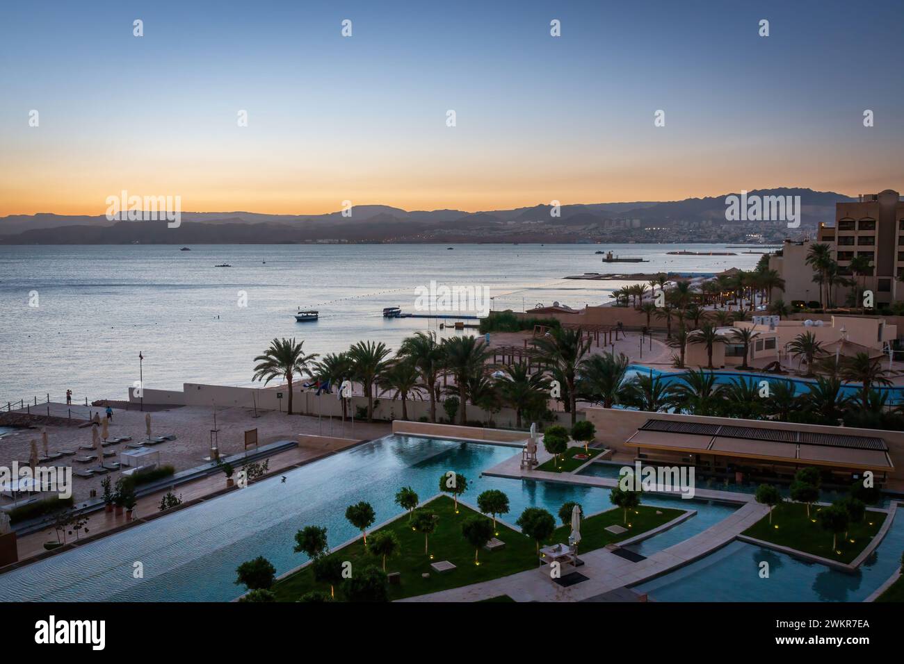 Scenic view of swimming pool and beach at Gulf of Aqaba in Aqaba ...