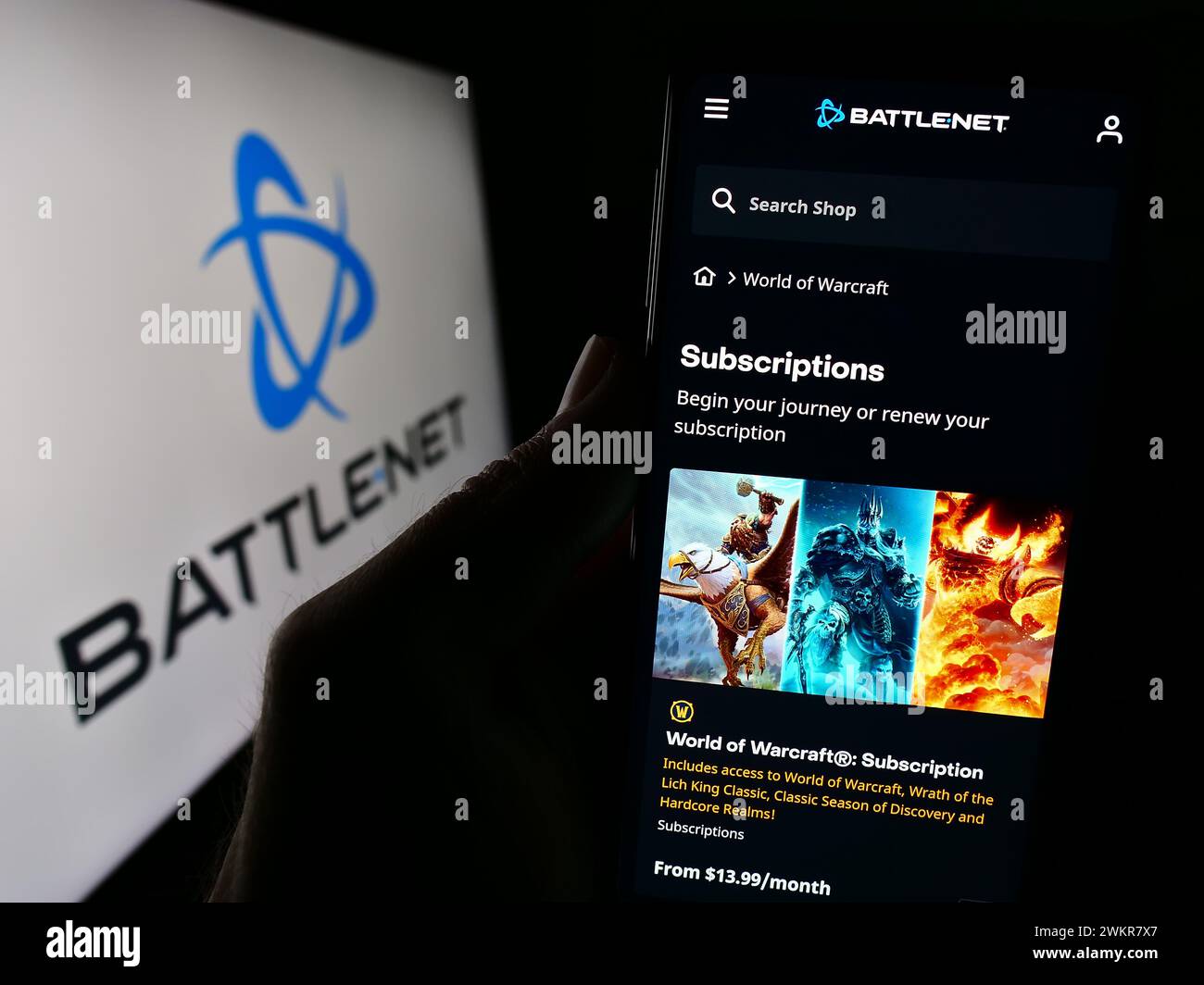 Person holding smartphone with webpage of online game platform Battle ...