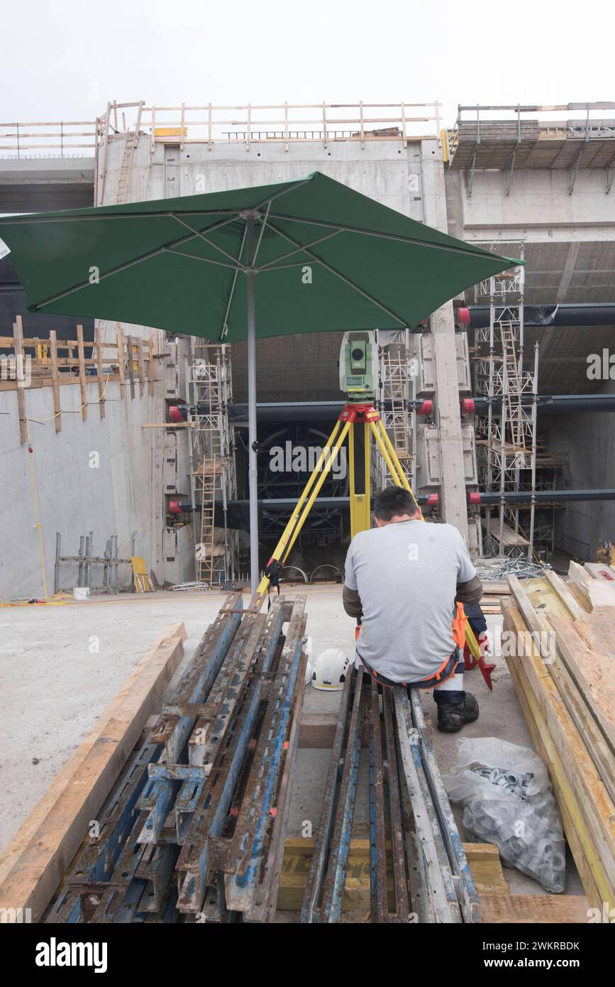 surveying by a land surveyor with measure instruments in geodesy ...