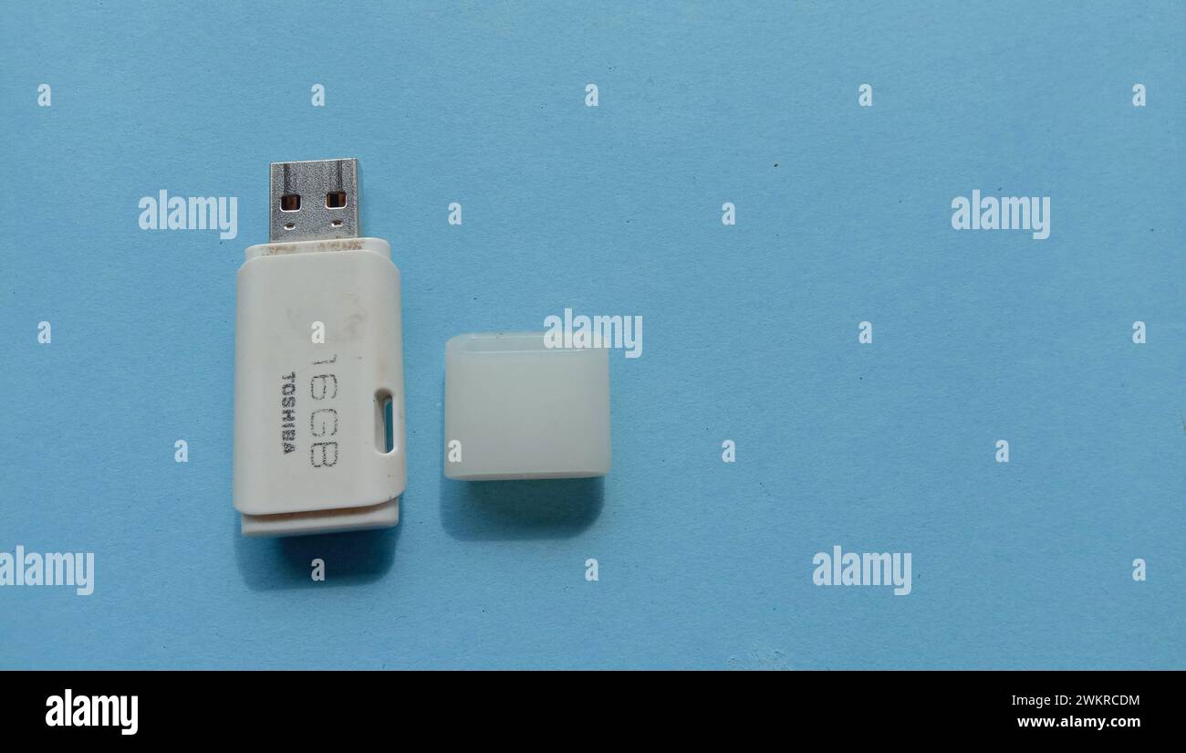 Photo of flashdisk and lid on blue background, photo of electronic ...