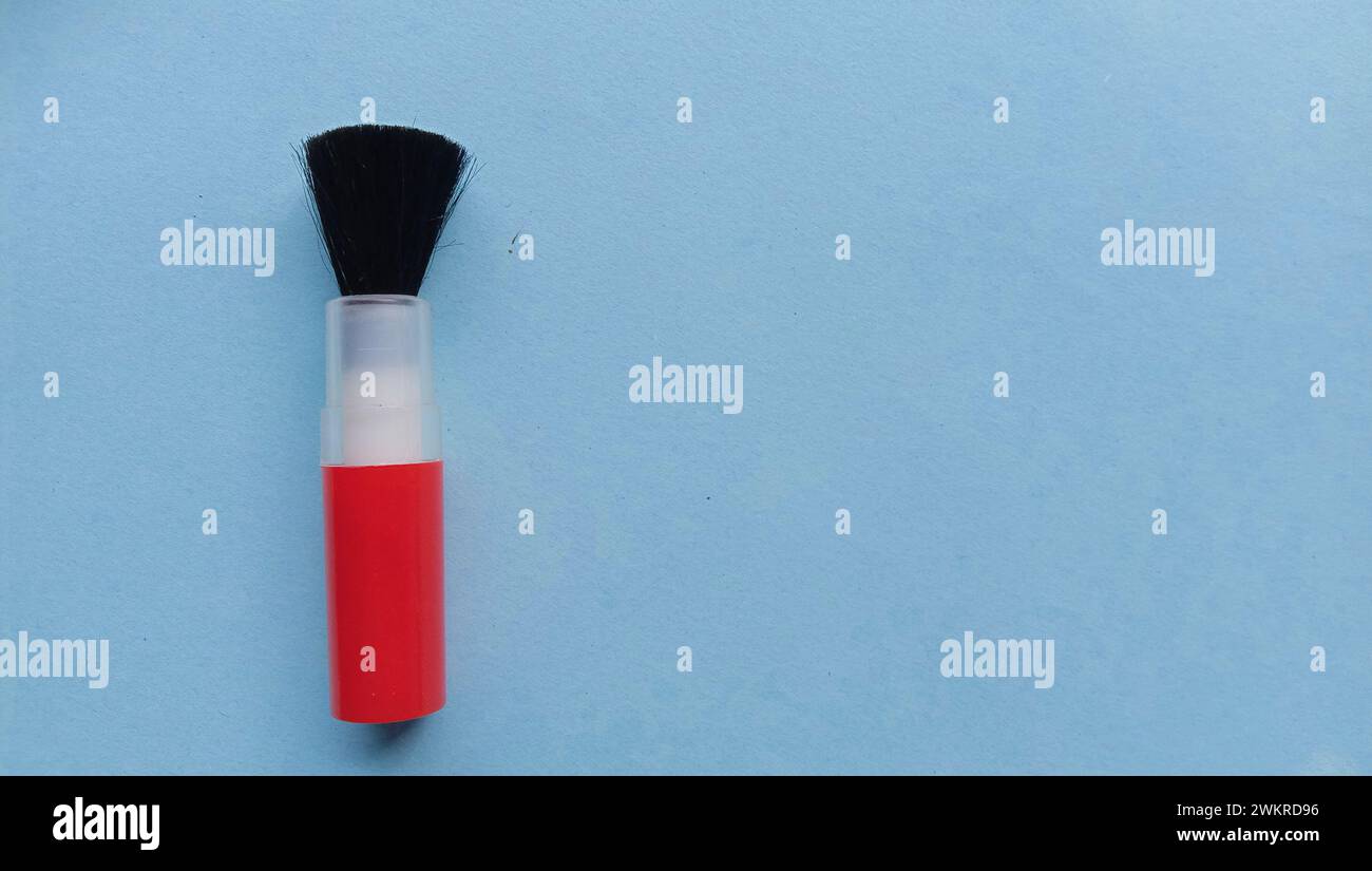 The photo tool for cleaning the camera is a brush and a blue background ...