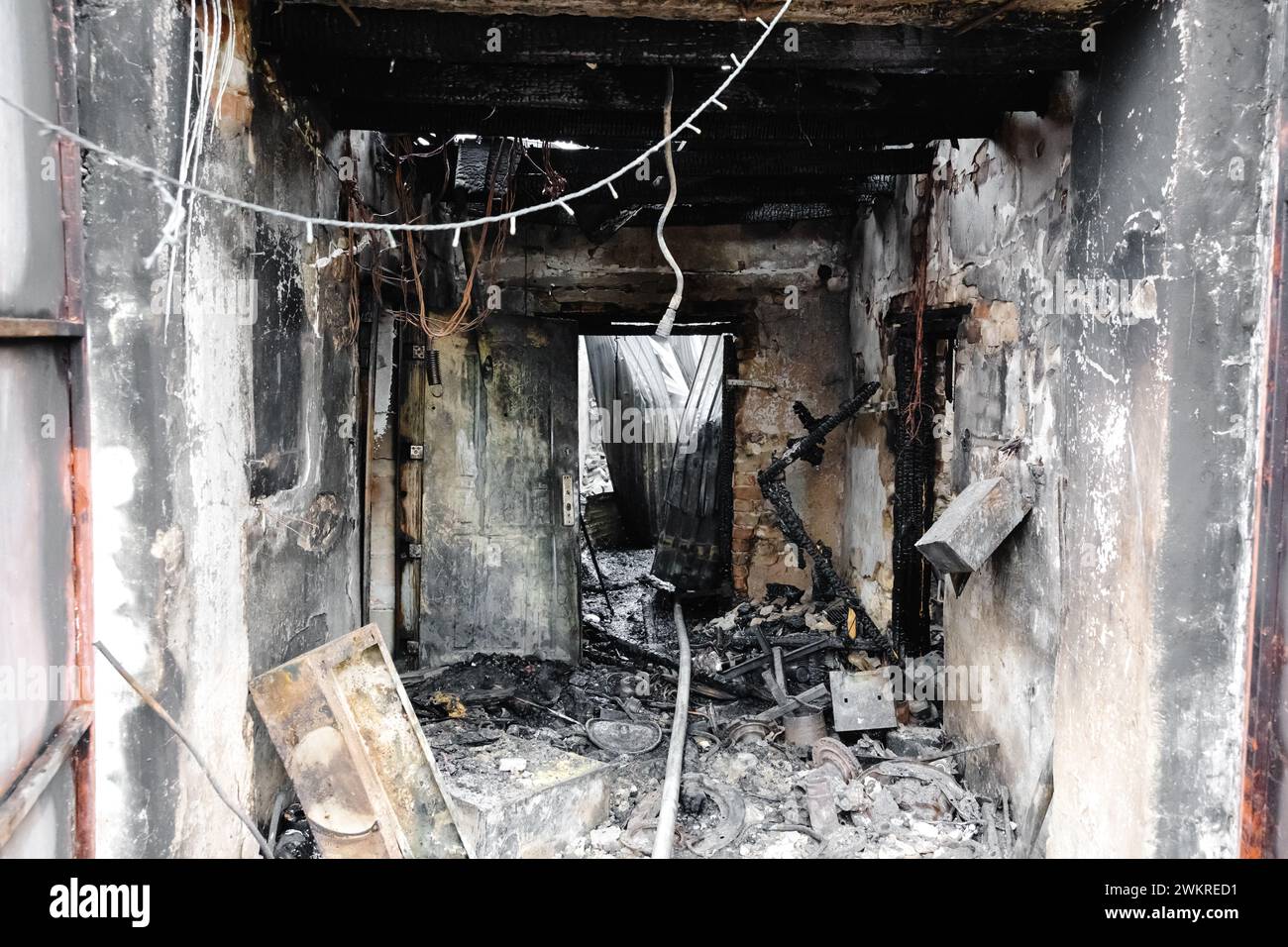 Fire-Damaged Building With Open Door Stock Photo - Alamy