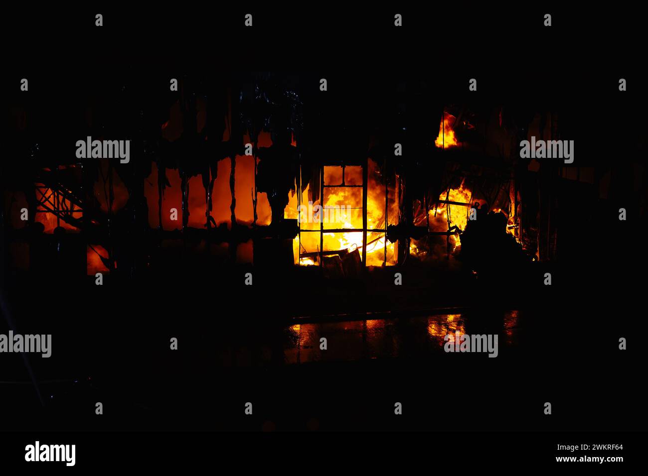 Fire Burning Inside Building at Night Stock Photo - Alamy