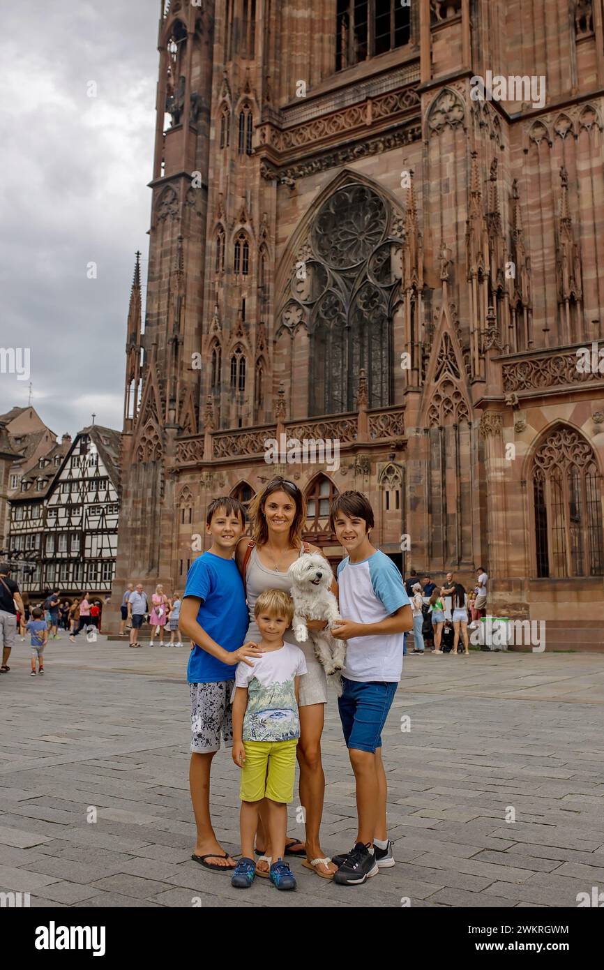 Beautiful family with children, boys, visiting Strasbourg in France ...