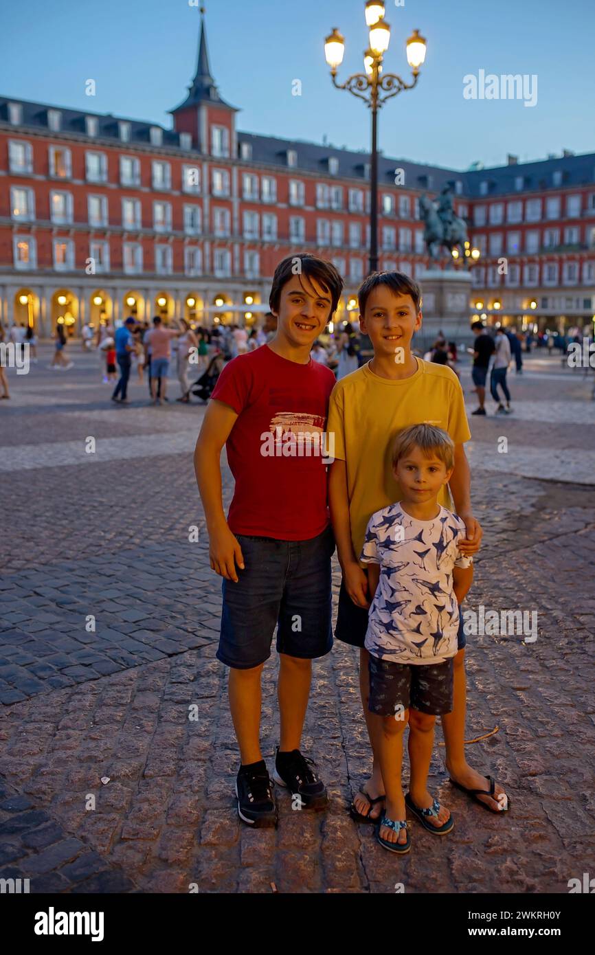 Family with children, siblings, visiting Madrid during family vacation ...