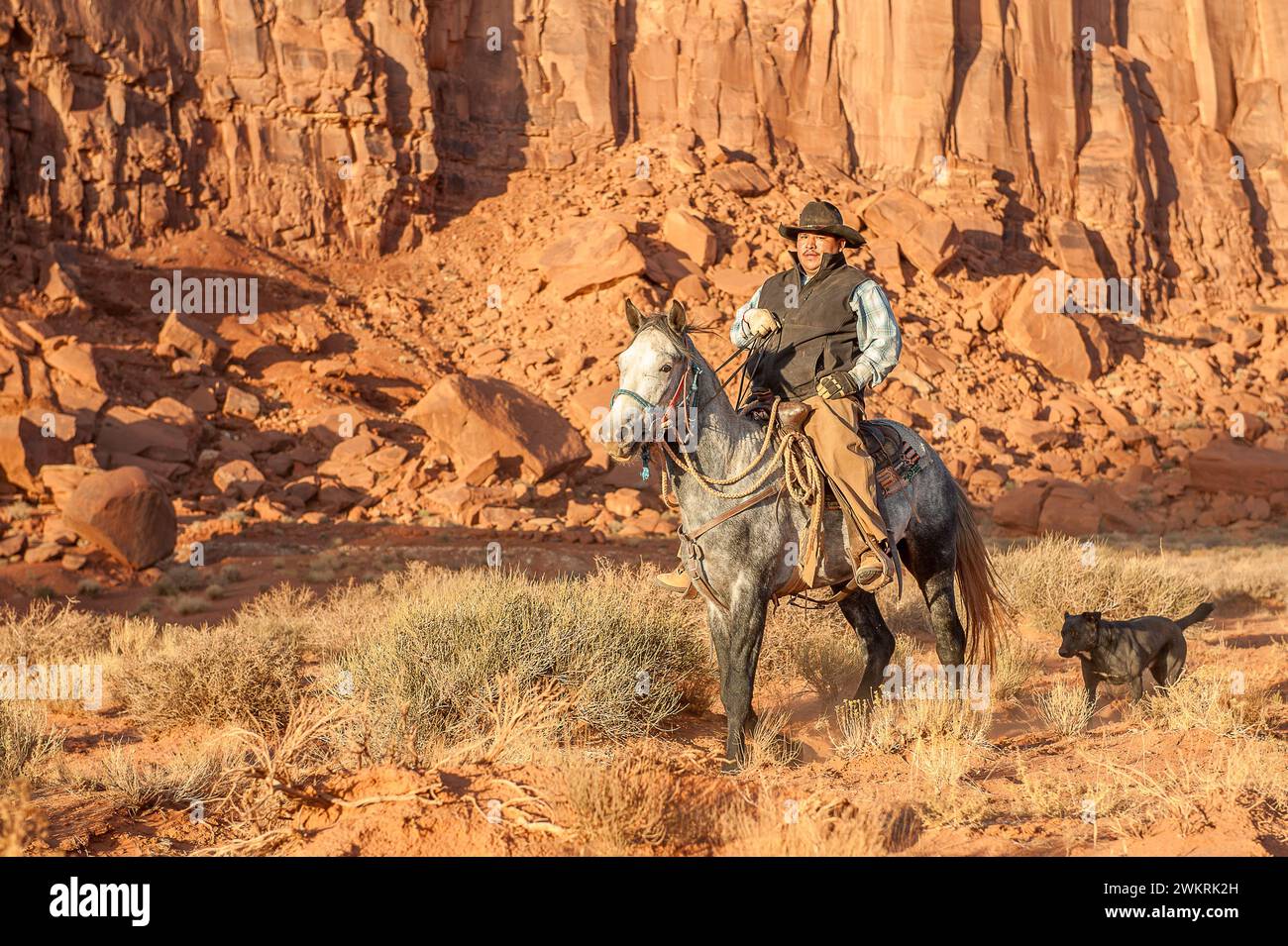 Native cowboy in Monument Valley, which is famous for its iconic buttes ...