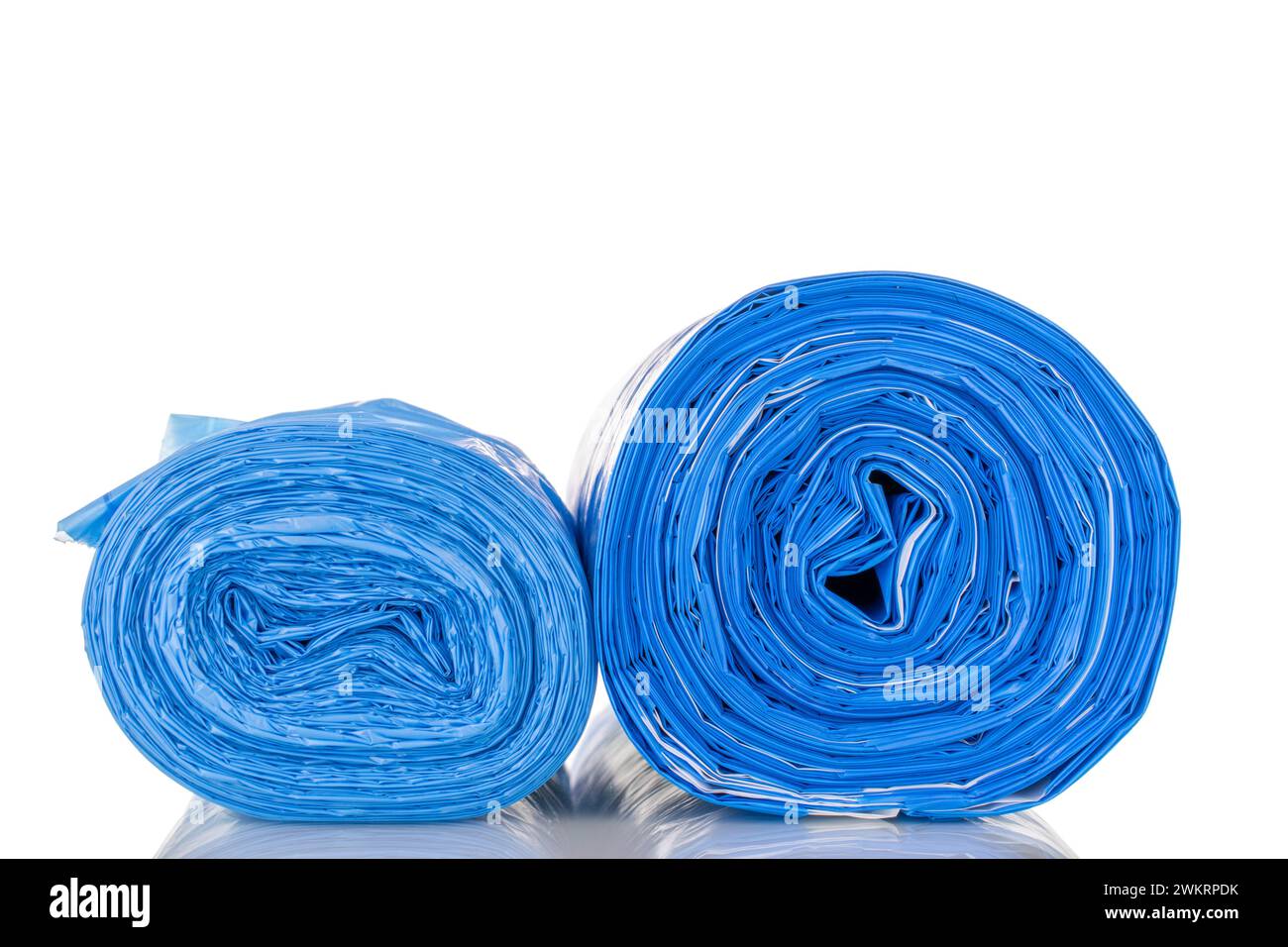 Two packs of plastic garbage bags, macro, isolated on white background ...