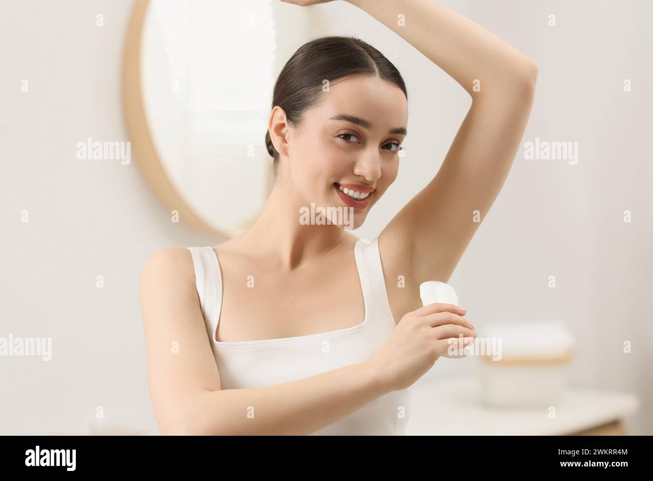 Woman antiperspirant deodorant bathroom hi-res stock photography and images - Alamy