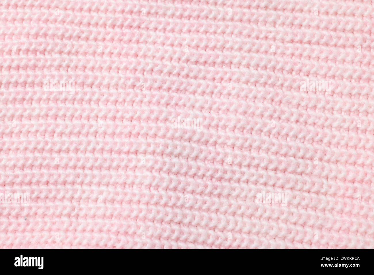Texture of soft pink knitted fabric as background, top view Stock Photo ...