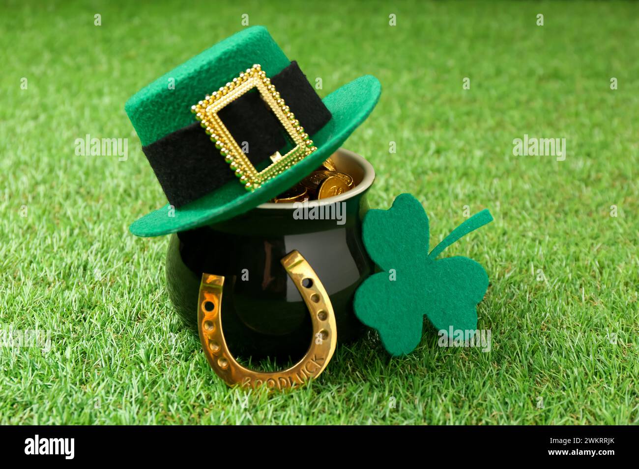 St. Patrick's day. Pot of gold with leprechaun hat, horseshoe and ...