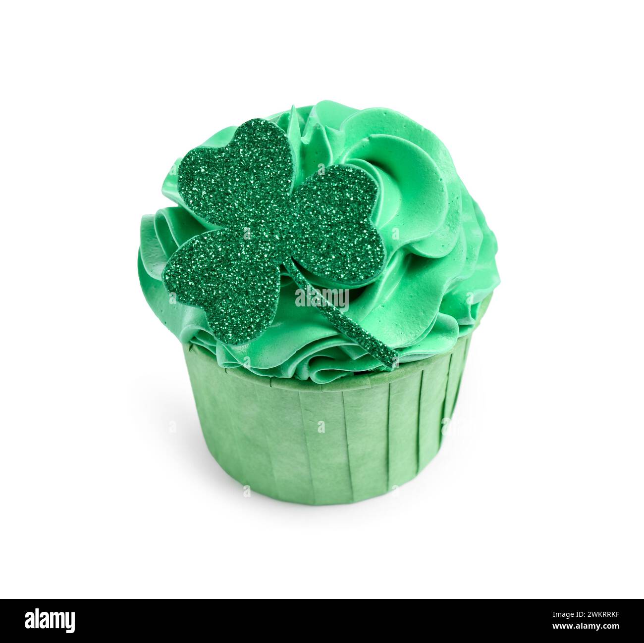 St. Patrick's day party. Tasty cupcake with green clover leaf topper ...