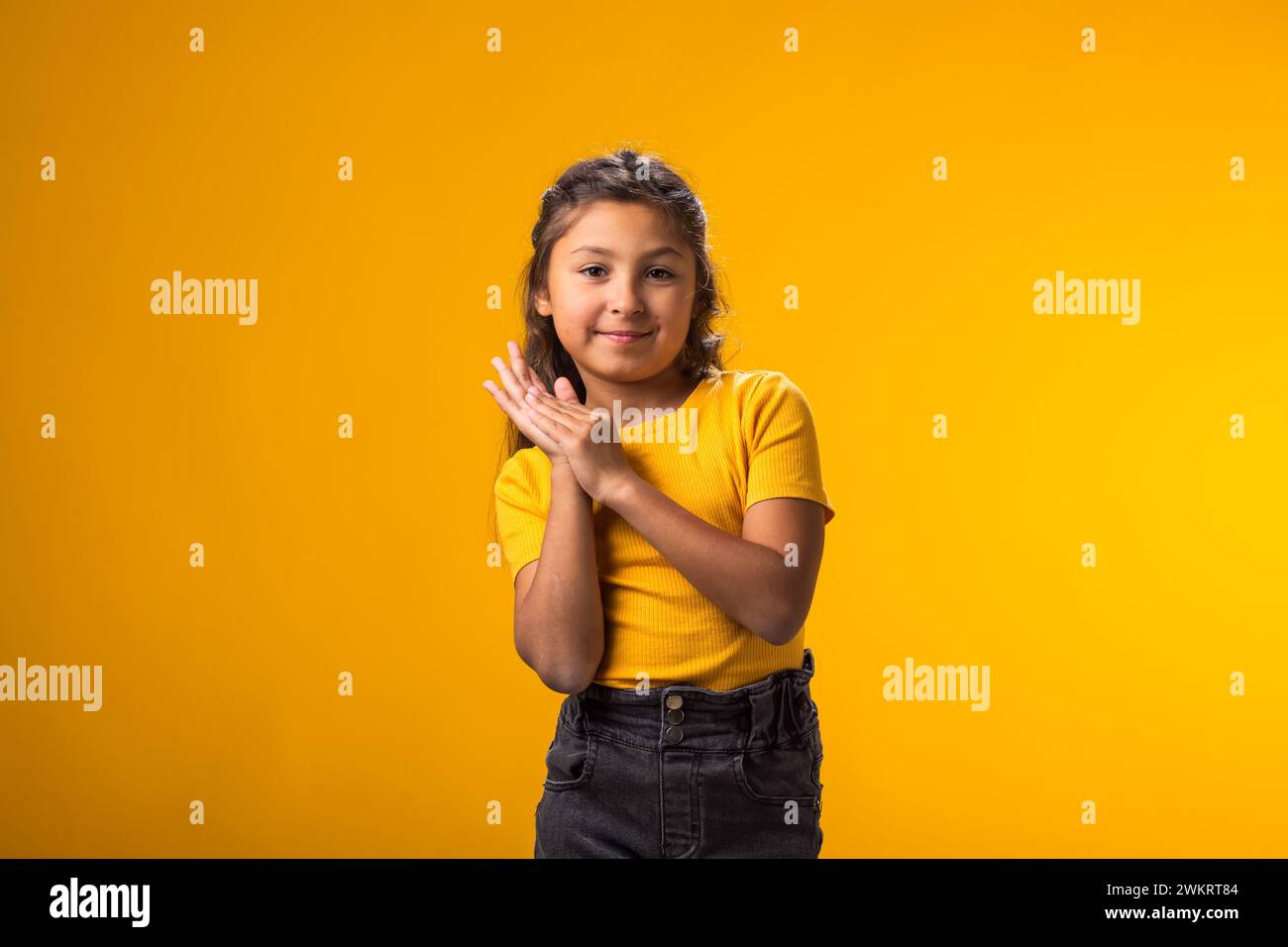 Portrait of kid girl clapping and applauding happy and joyful, smiling ...