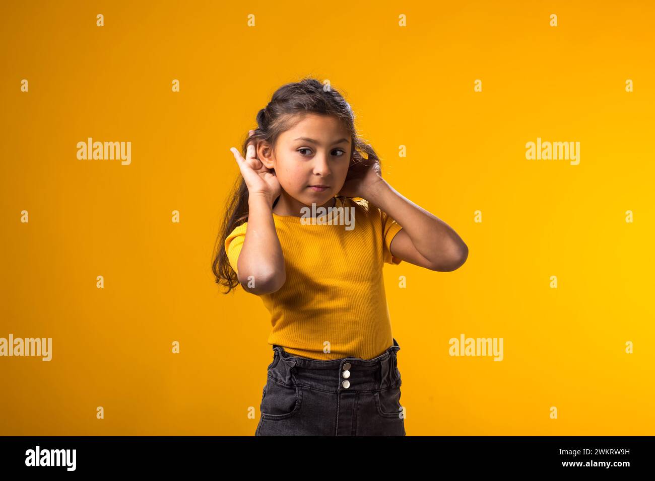 Portrait of kid girl eavesdropping, overhearing confidential secret ...
