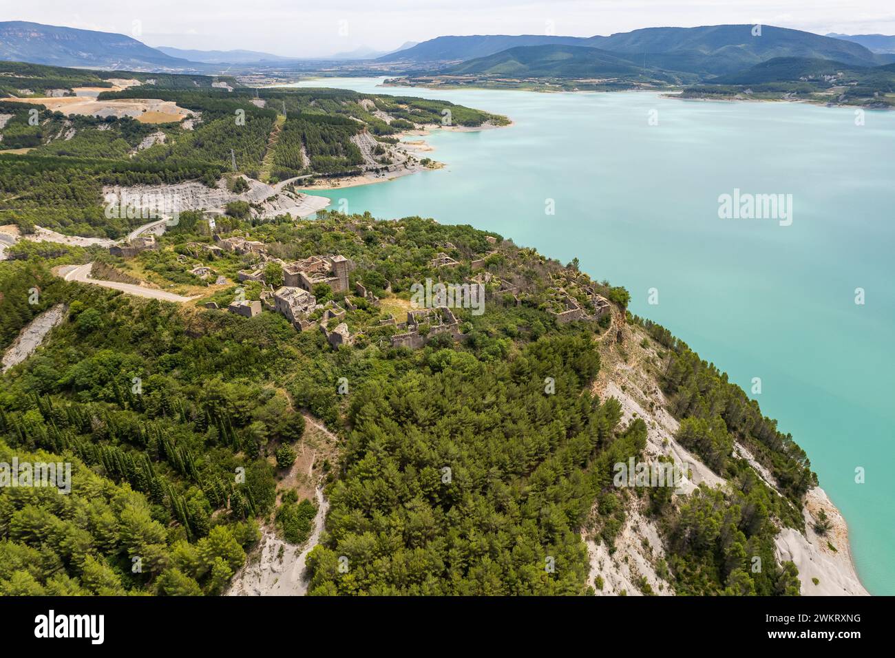 Aerial view of ruins of abandoned village of Tiermas by Yesa reservoir ...