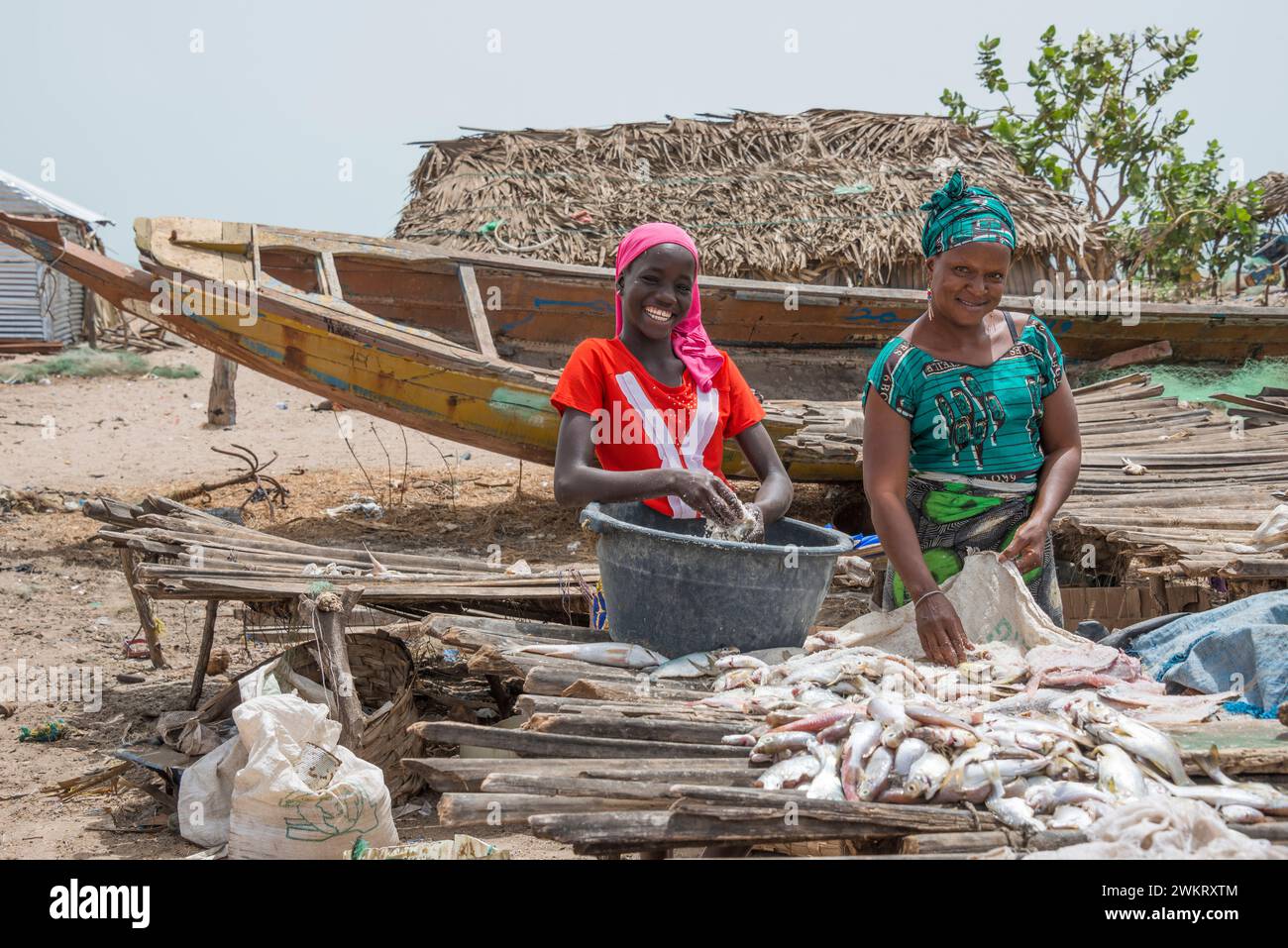 Women drying fish on Sanyang beach on the coast of The Gambia Stock ...