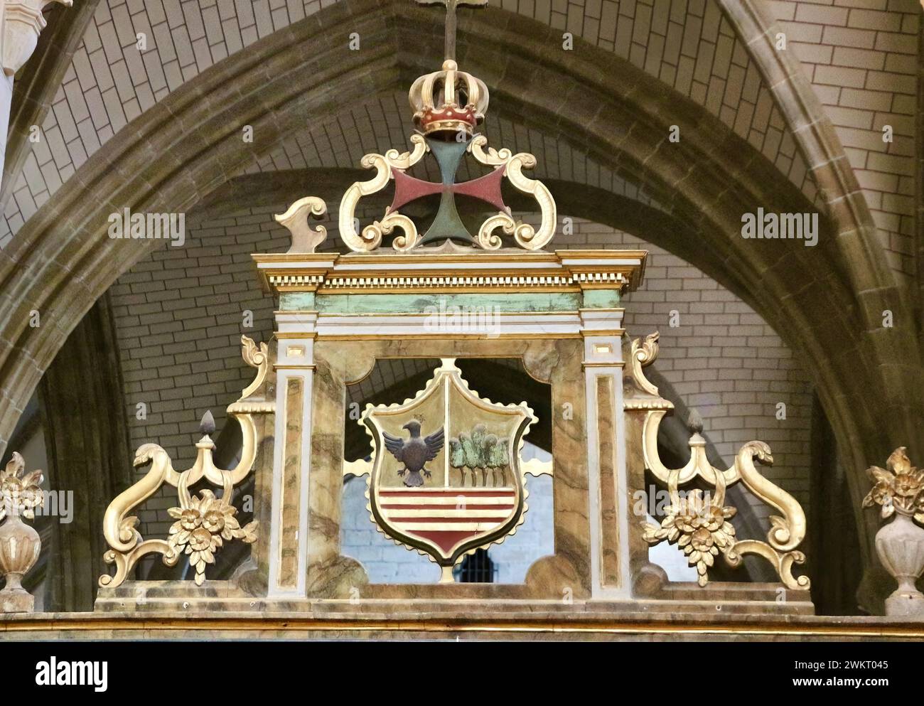 Decorative painted coat of arms with a crown inside the Colegiate of ...