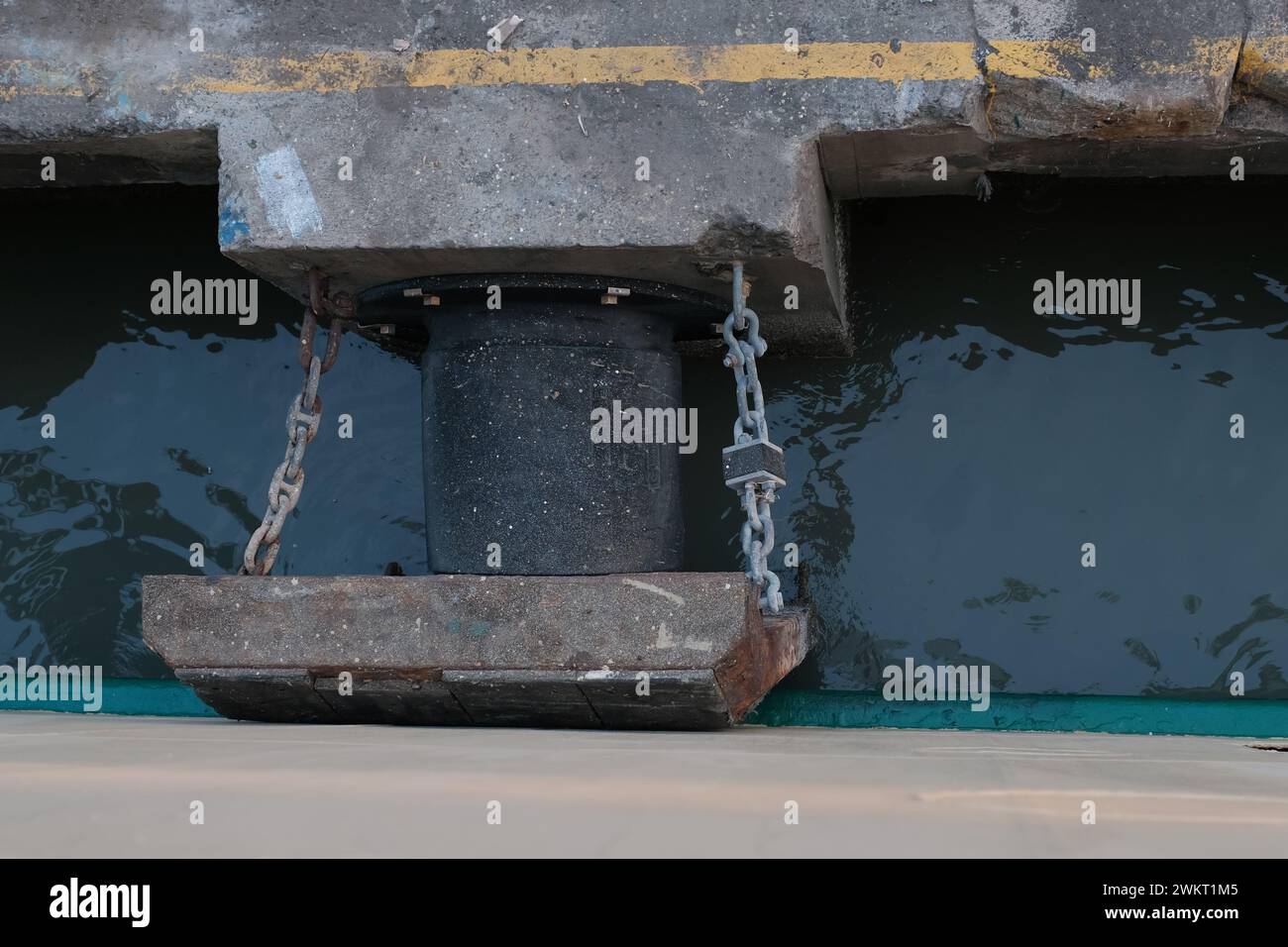 Marine fender absorber on pier Stock Photo - Alamy