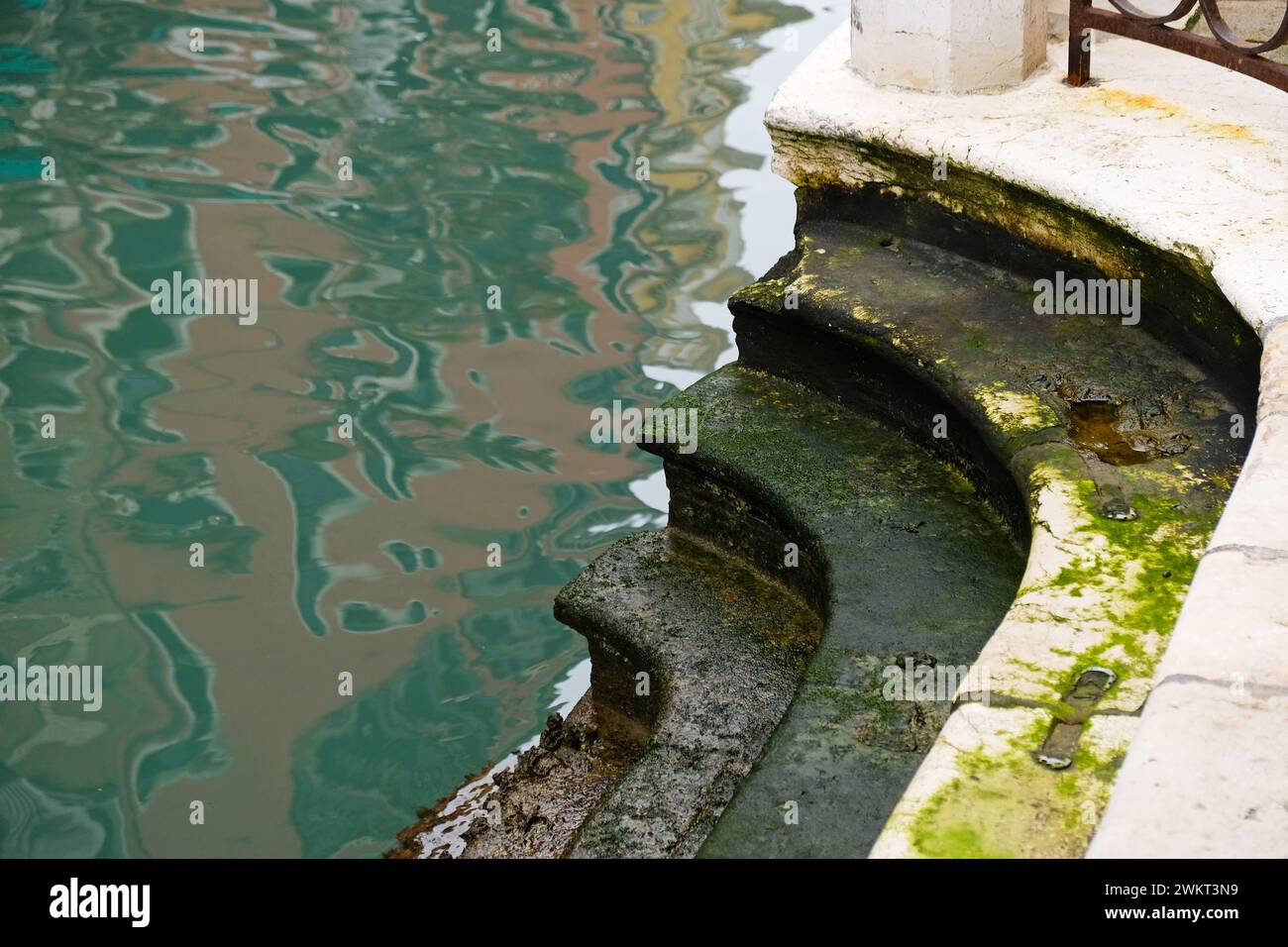Stone Stairs covered with algae along a canal during low tide in Venice ...