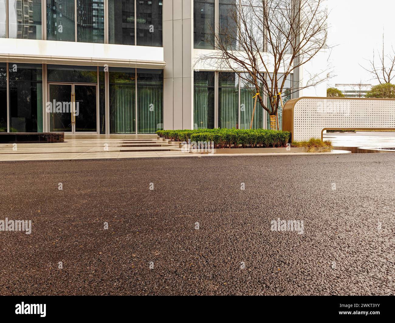 empty asphalt road in downtown of modern city during daytime. copy ...
