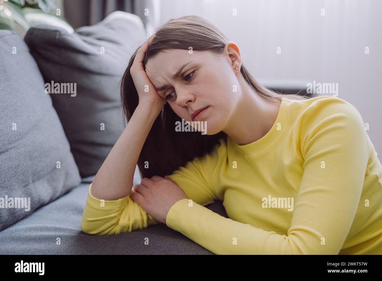 Portrait of unhappy young woman expression face thinking about problem ...