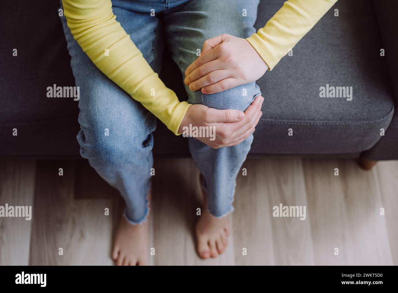 Muscle pain or leg pain. Close up top view of young female massaging ...