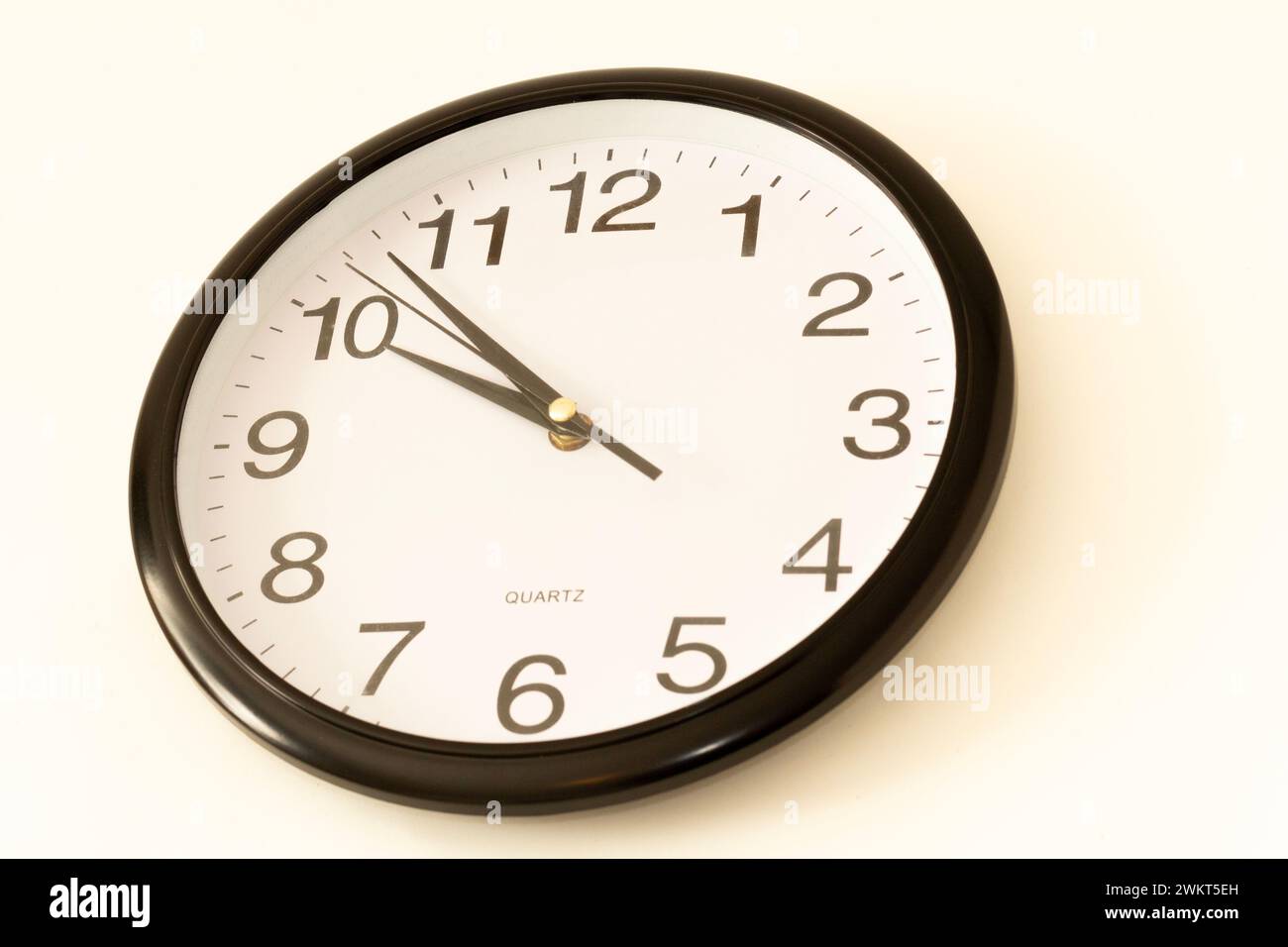 SPECTACULAR WALL CLOCK ON A WHITE BACKGROUND WITH NEGATIVE SPACE Stock ...