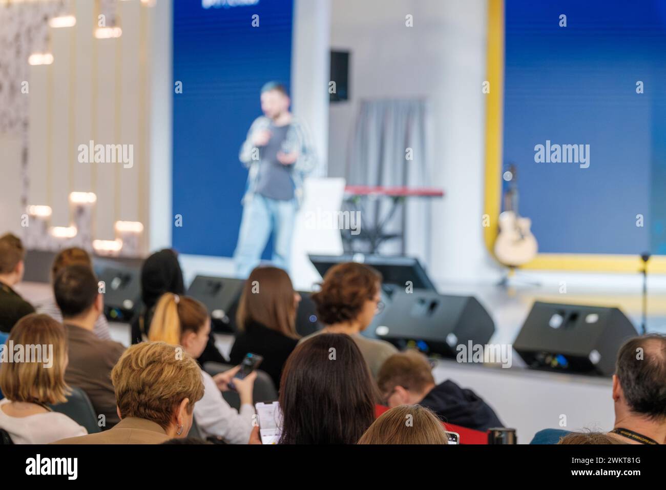 Focused audience listening to a speaker at a professional seminar ...