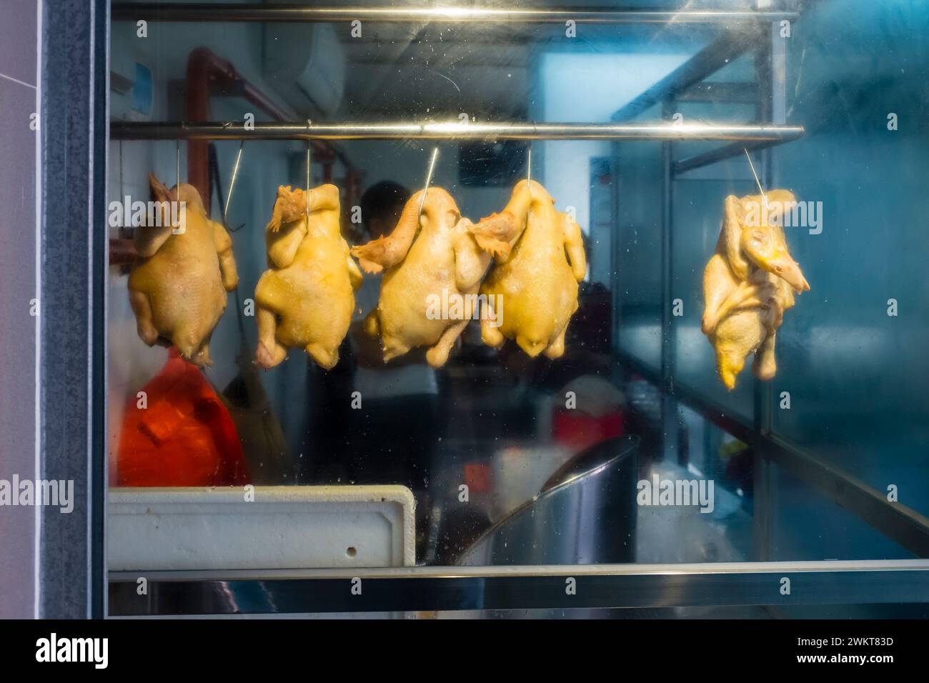 A window display of poached chicken and duck in a Market food stall ...