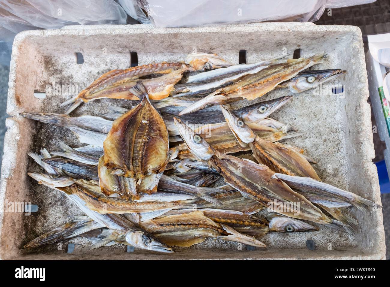 A small box of dried preserved fish for sale in market stall Stock ...