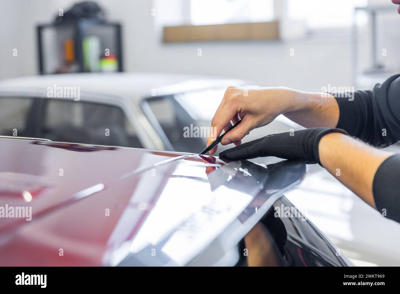 Process of gluing or wrapping a new foil wrap to a car, car detailing ...