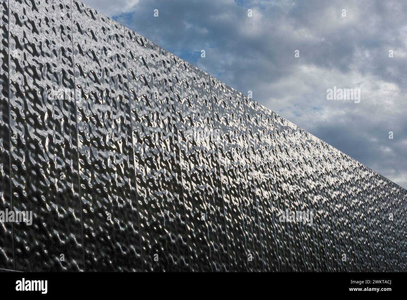 Metal building facades that mimic the texture of rippling water ...