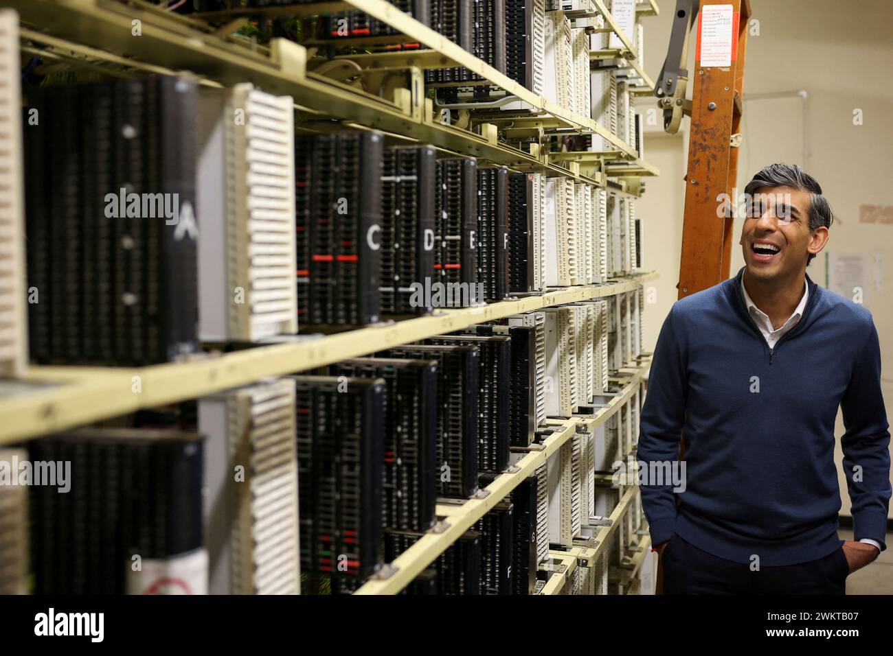 British Prime Minister Rishi Sunak reacts as he looks at traditional ...