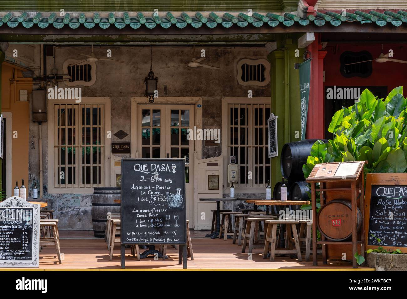 Multiple signs and chalkboards displayed on a building facade Stock ...