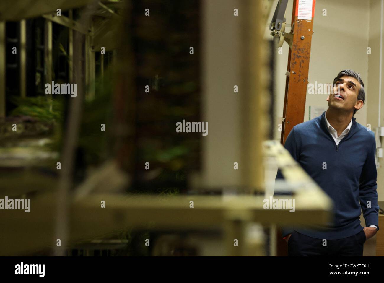 Prime Minister Rishi Sunak looks at traditional copper telephone wires ...