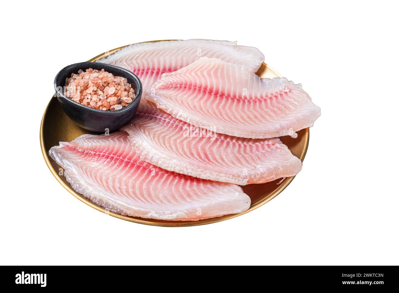Raw fish fillet of tilapia in a plate with spices. Isolated on white ...