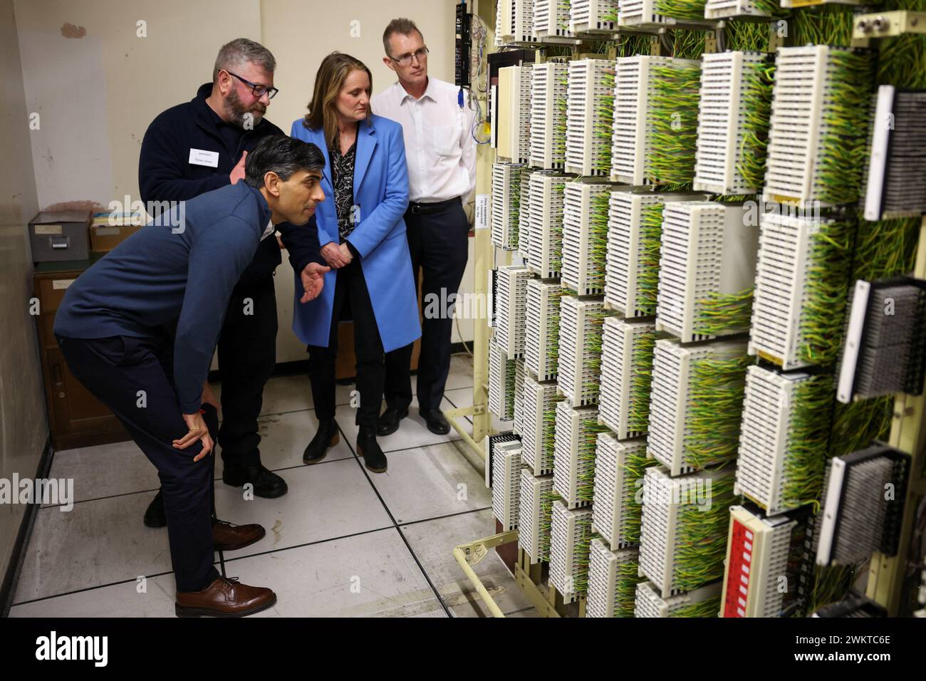 Prime Minister Rishi Sunak looks at traditional copper telephone wires ...