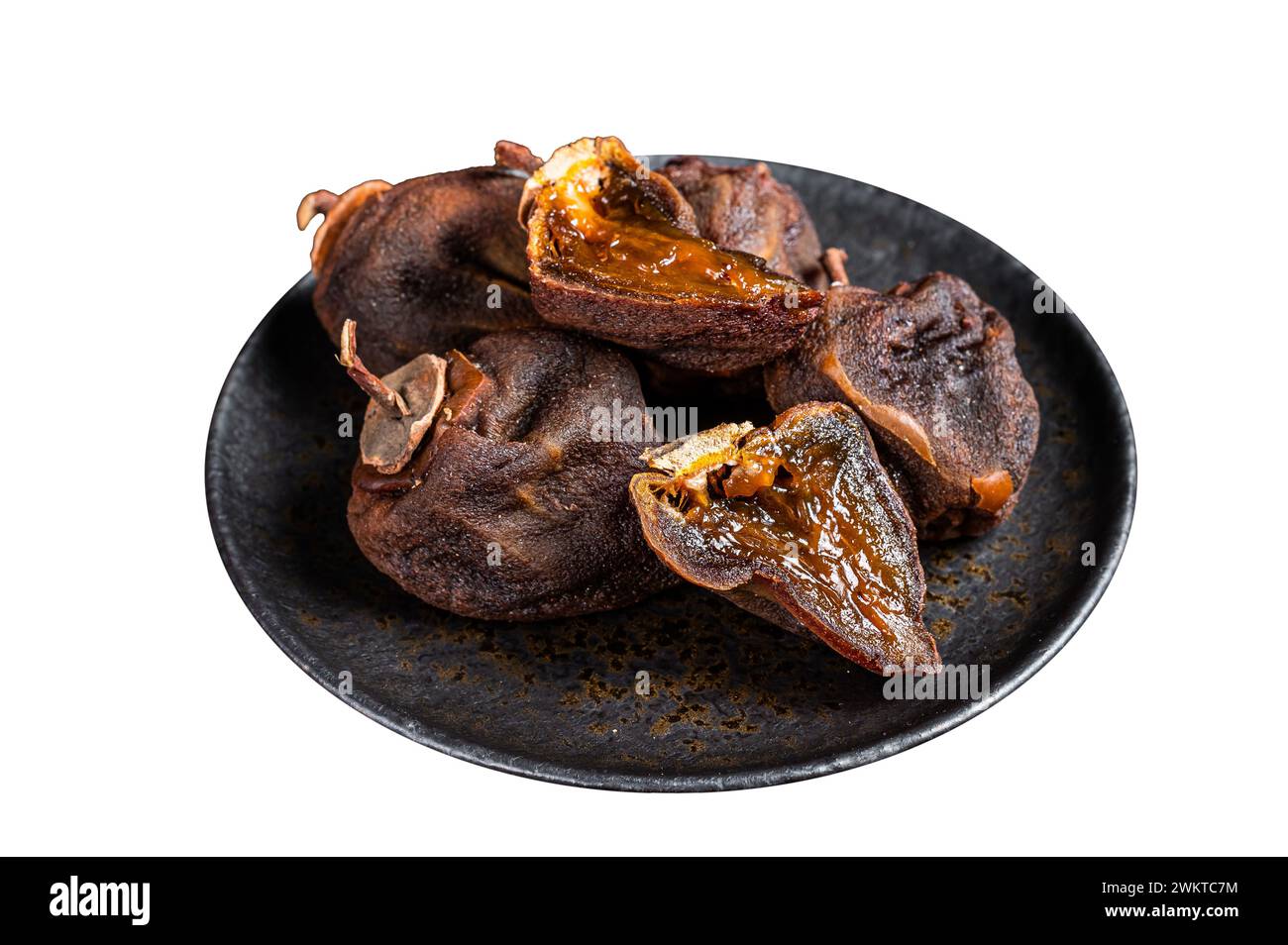 Dried persimmon fruit on a plate. Isolated on white background Stock ...
