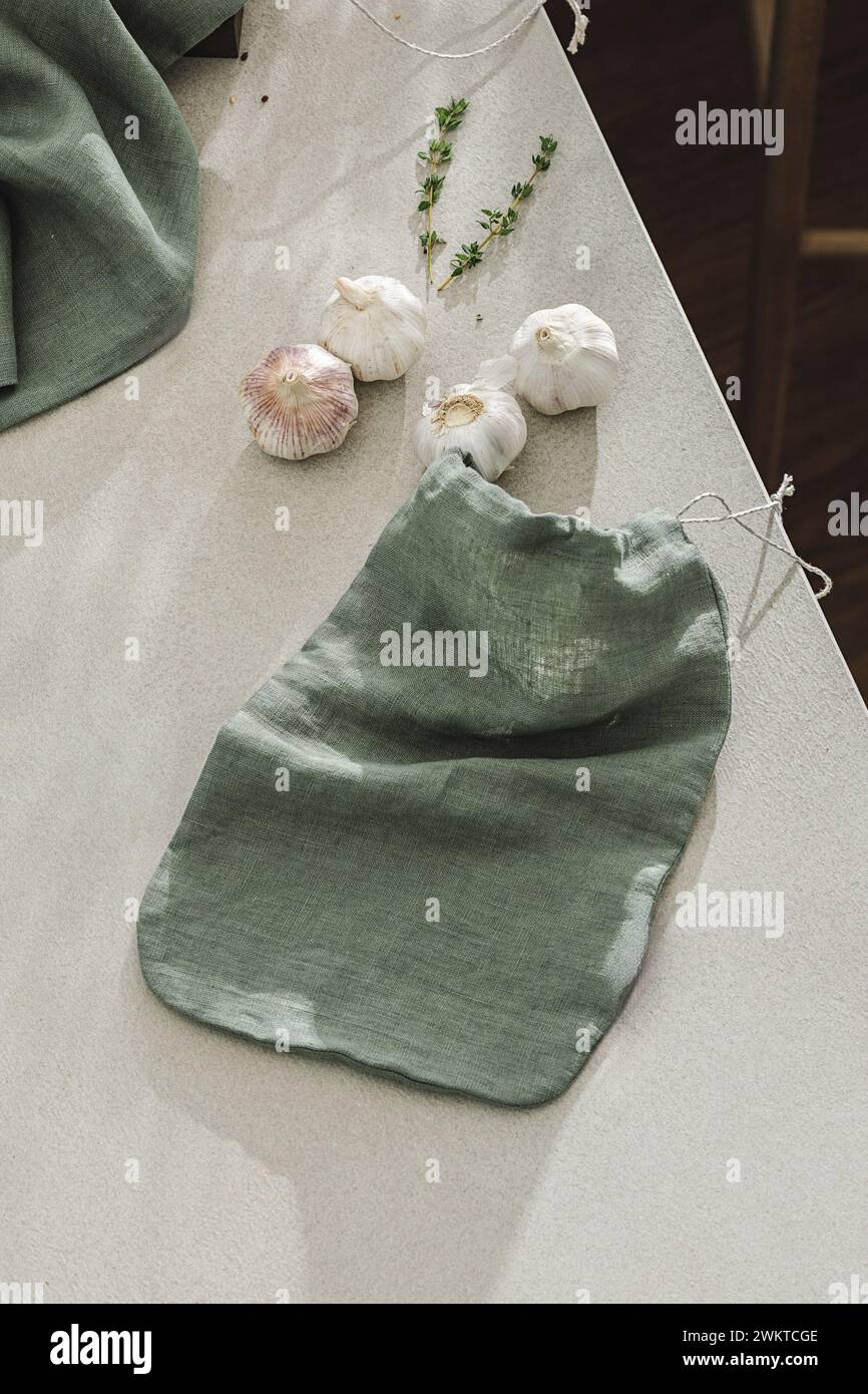 fresh herbs, organic garlic in linen bag. Kitchen aesthetic concept ...