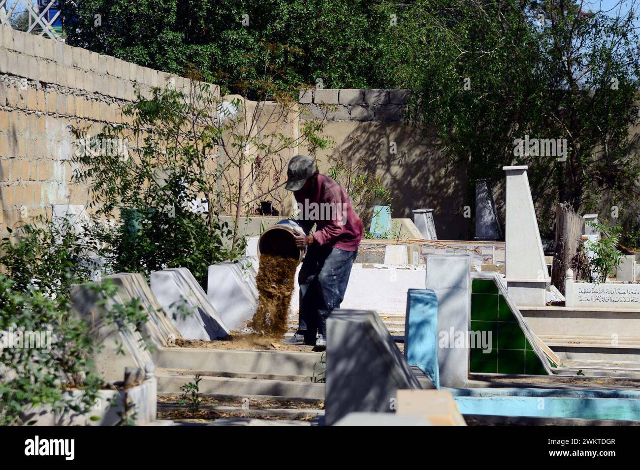 Family members are busy in cleanliness of graves and surrounding on ...