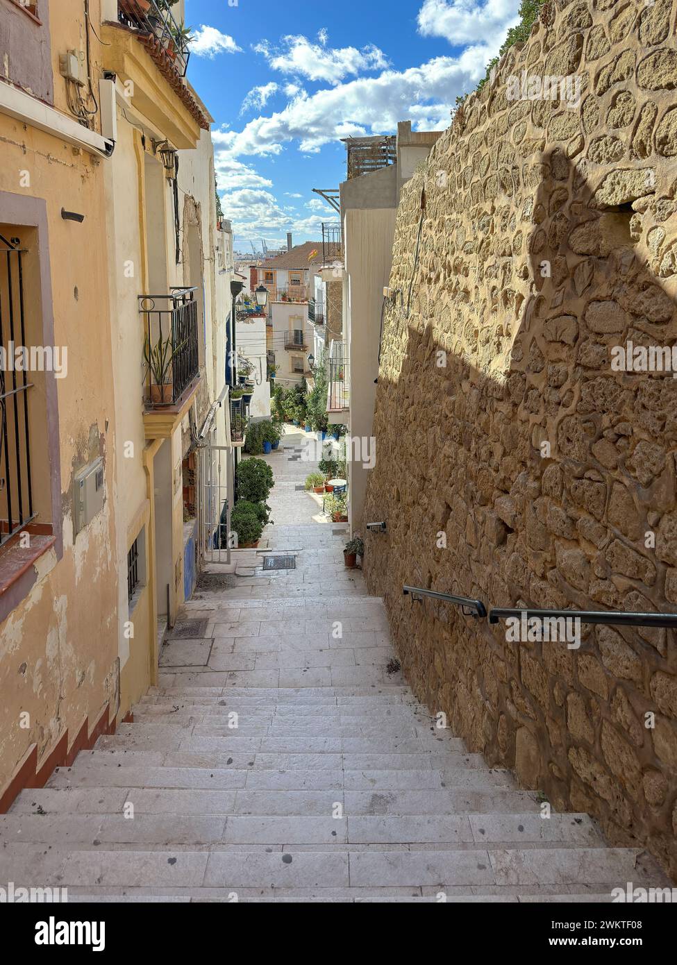 Narrow alleyway with steps in Santa Cruz district, Alicante, Spain ...
