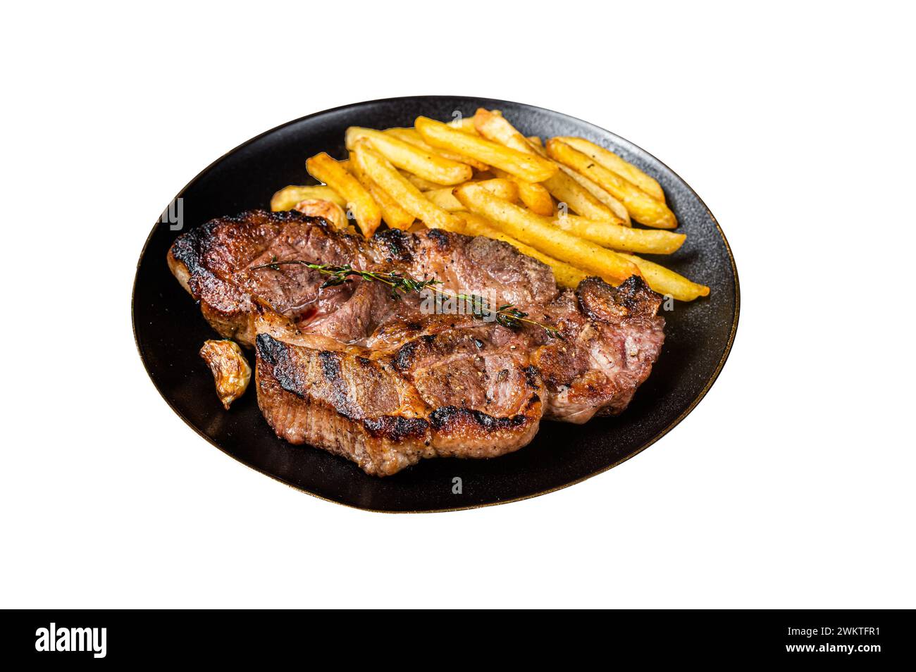 Roasted pork steaks from neck meat in plate with potato chips. Isolated ...