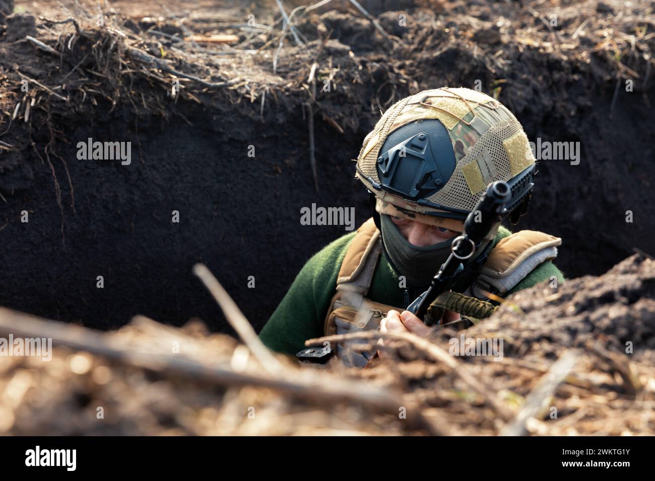A Ukrainian Armed Forces soldier is seen with a rifle in a trench at a ...
