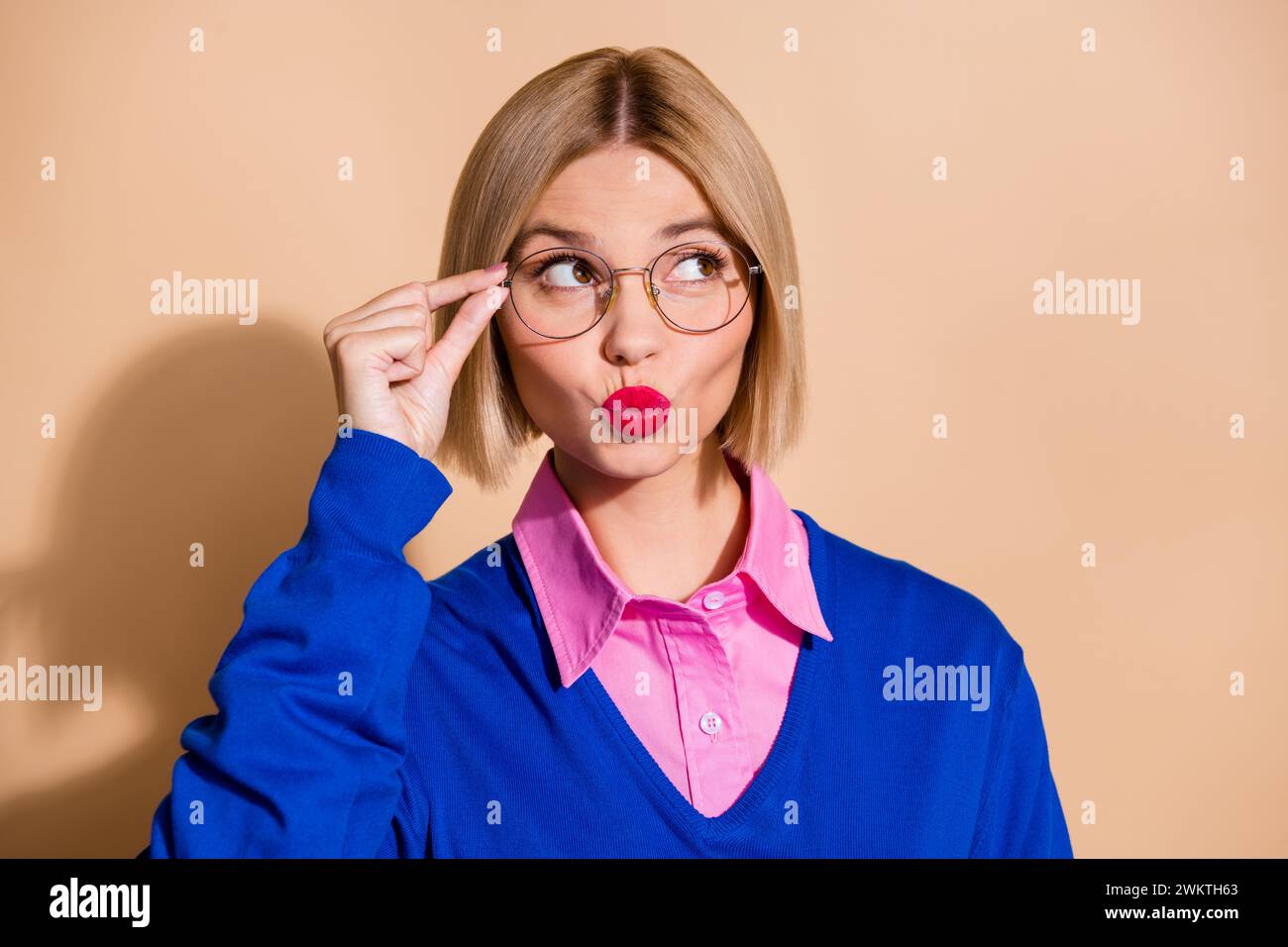Photo of charming minded girl pouted lips arm touch eyewear look empty ...