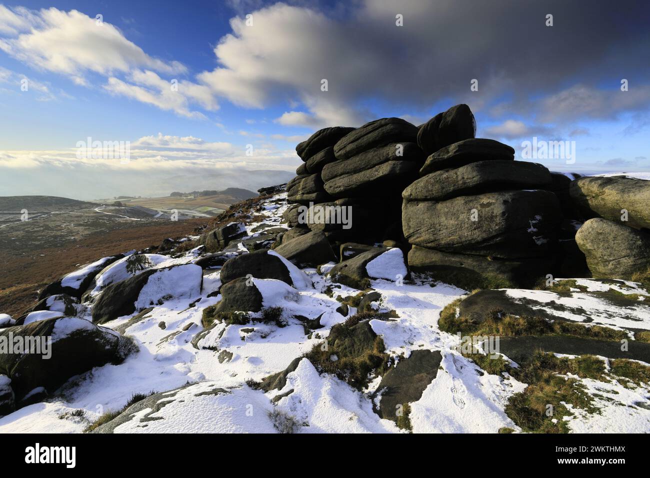 Winter snow over rock formations on Burbage Edge, Derbyshire; Peak ...