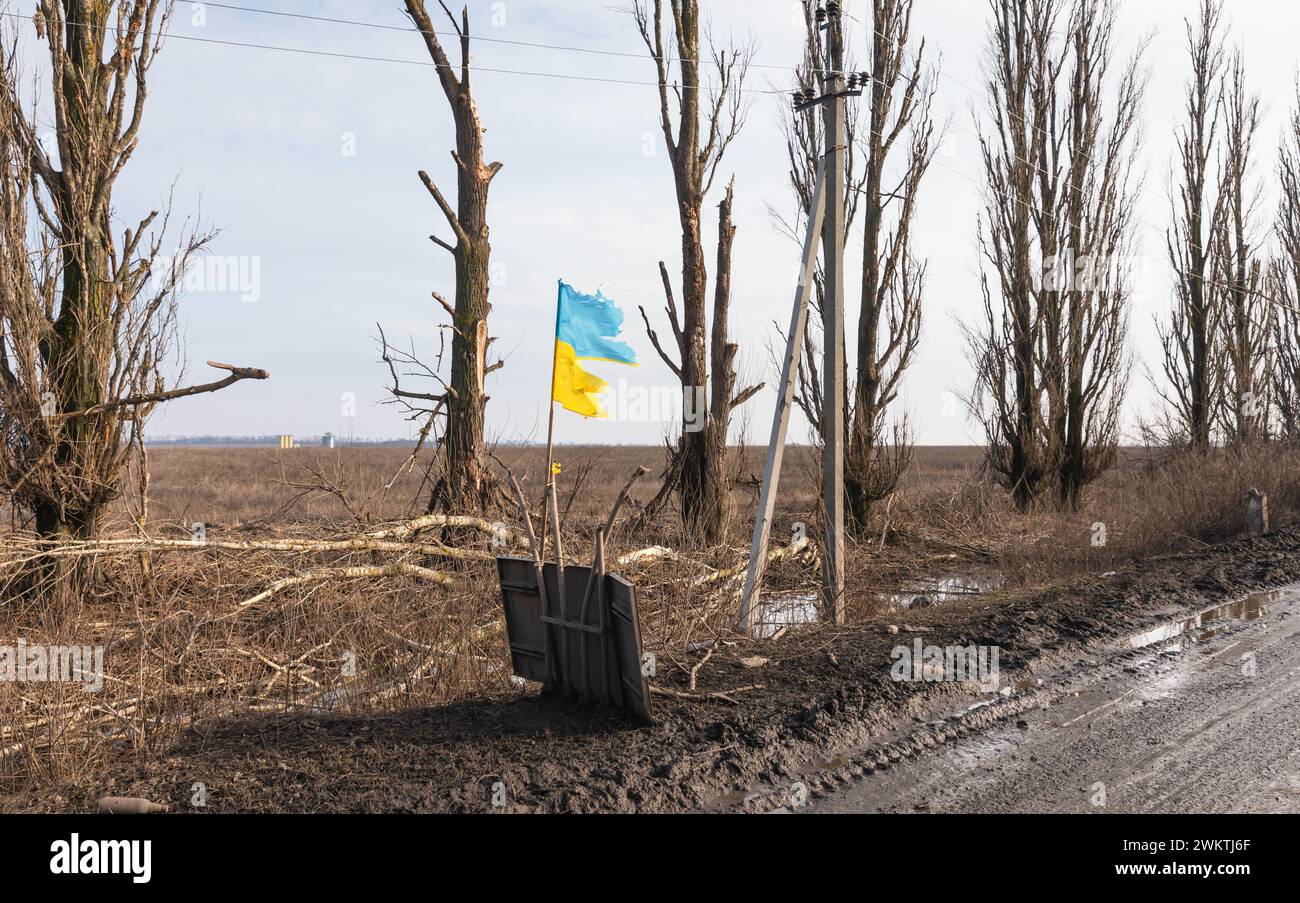 Donetsk Reg, Ukraine. 14th Feb, 2024. A torn but proudly flying flag is ...