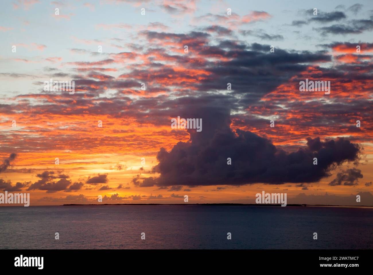 The scenic view of dramatic orange color sky over Little Stirrup Cay ...