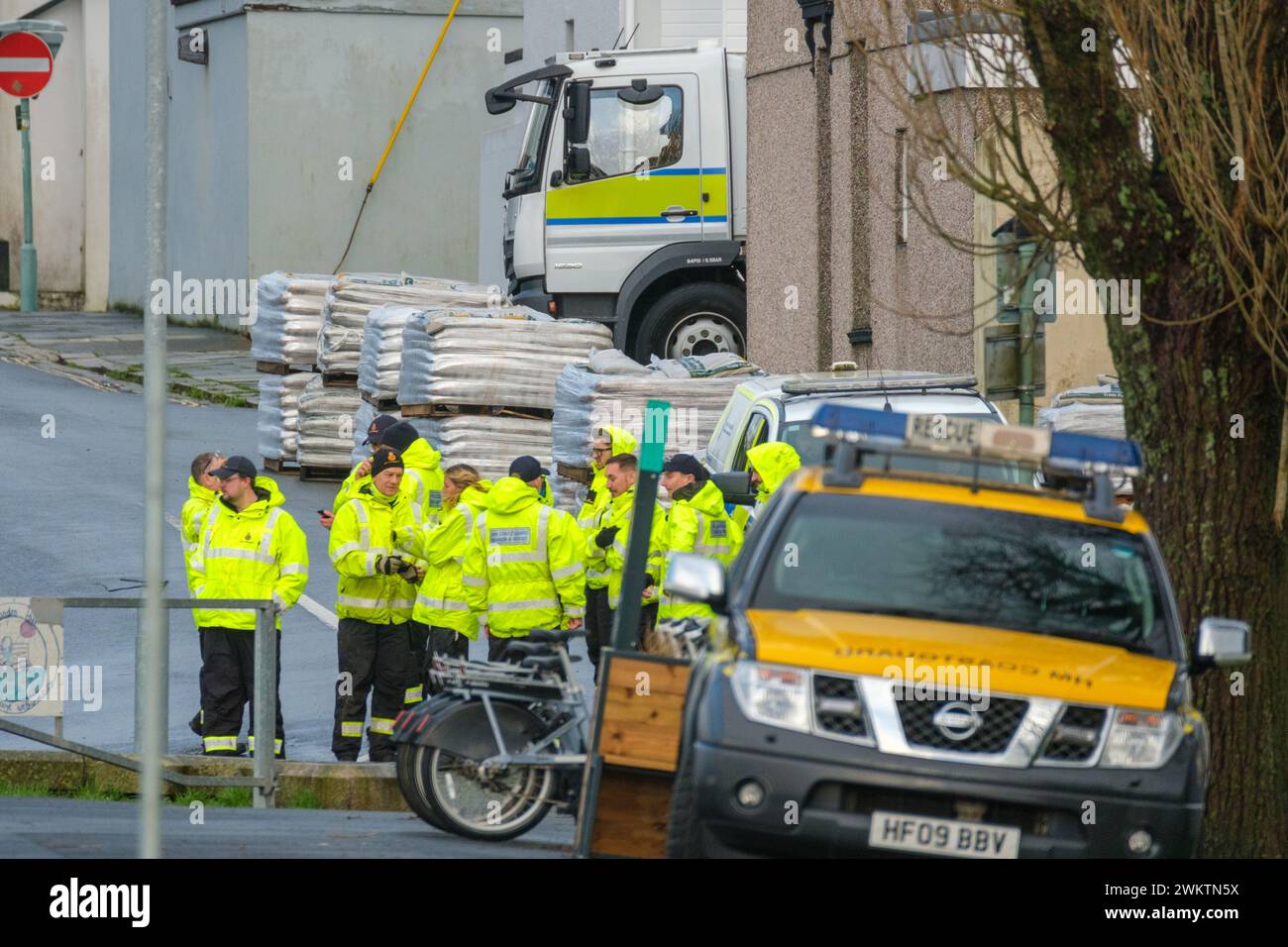 Members of HM Coastguard Search and Rescue gather after homes were ...