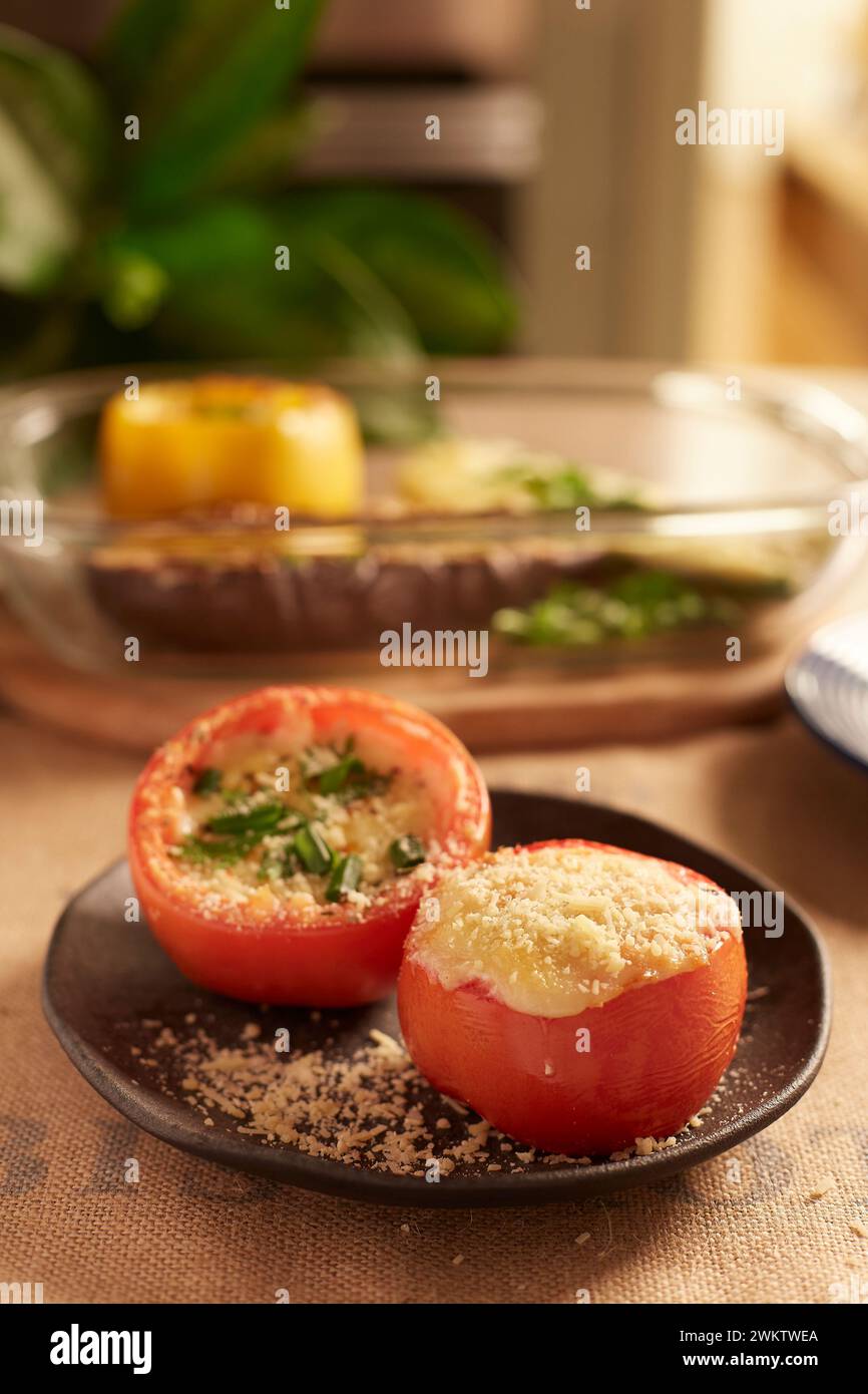 A plate with red tomatoes and grated meat Stock Photo - Alamy